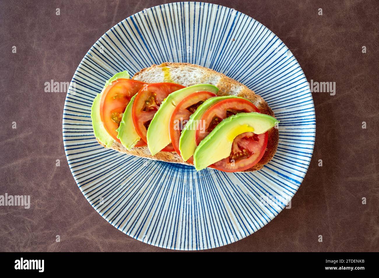 a birds eye view over a slice of white bread toast topped with sliced ...
