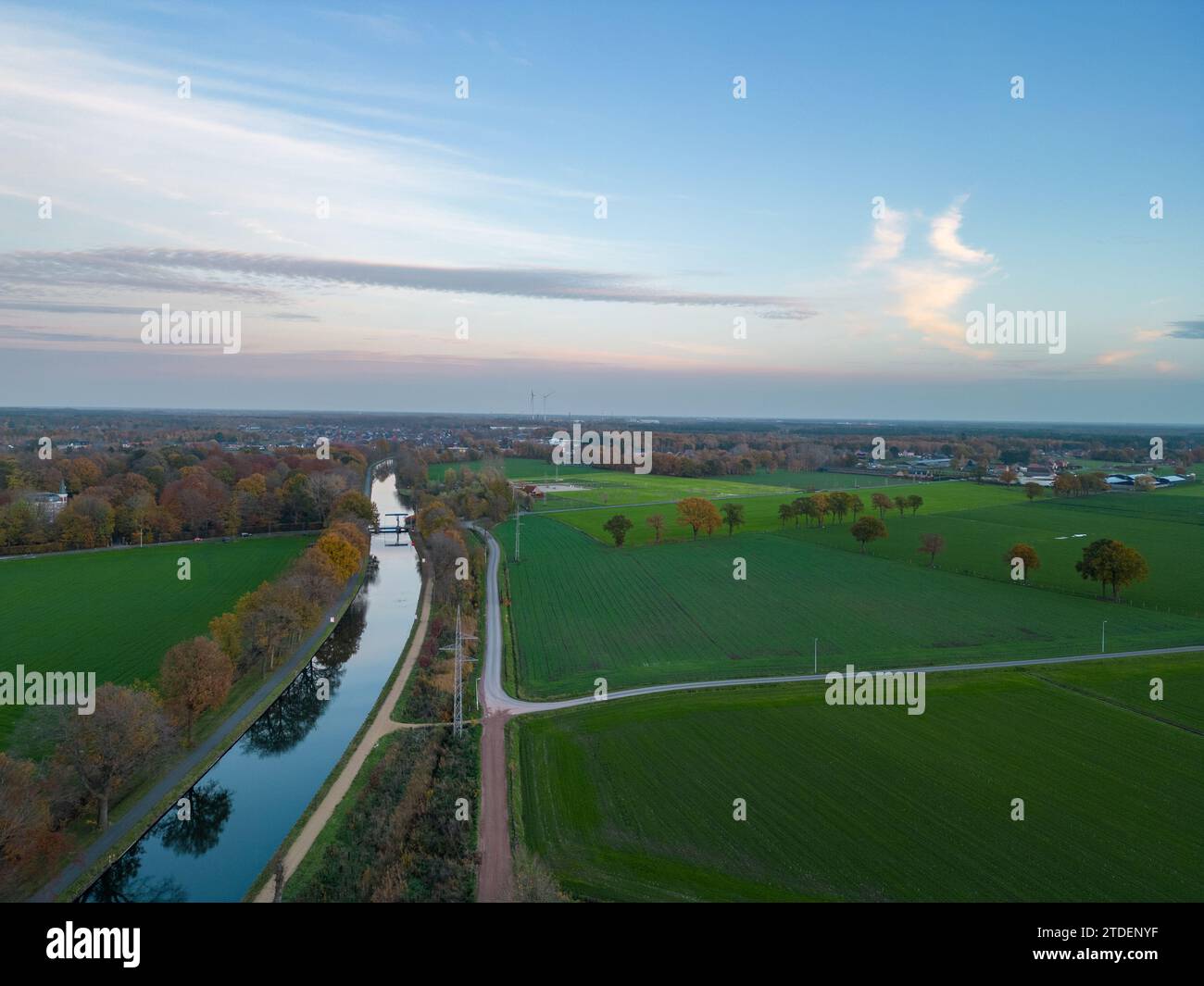 This image provides an aerial view of a tranquil canal cutting through ...