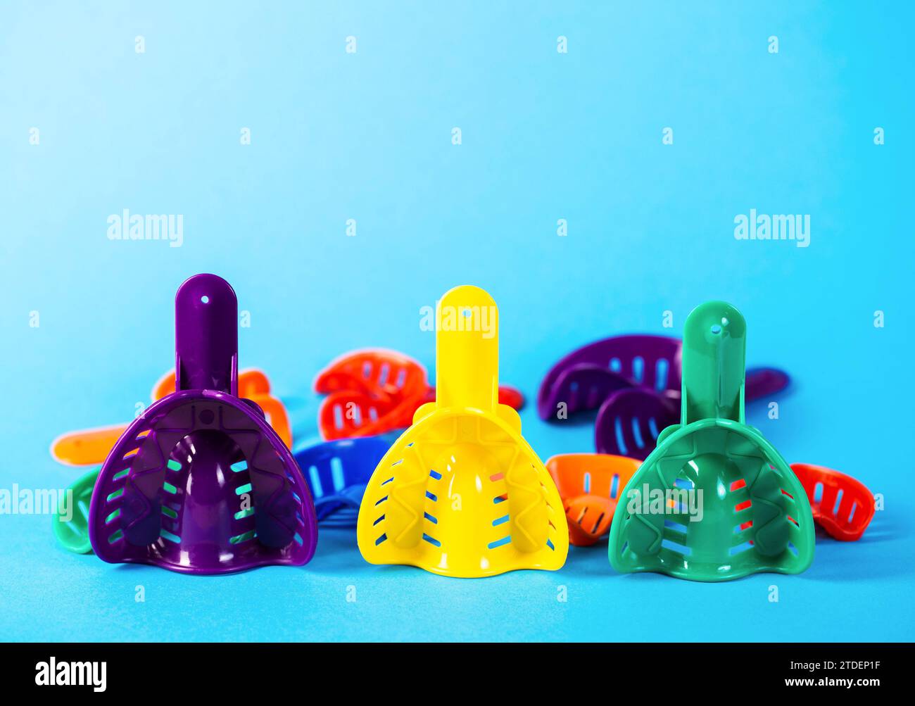 Multi-colored dental spoons for taking an impression of the dental jaw ...