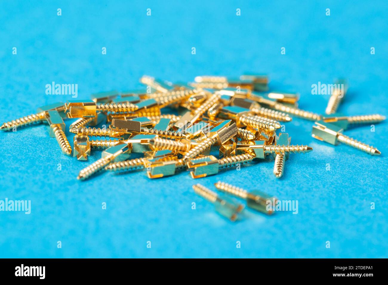 Lots of metal dental pins on a blue background. The concept of ...