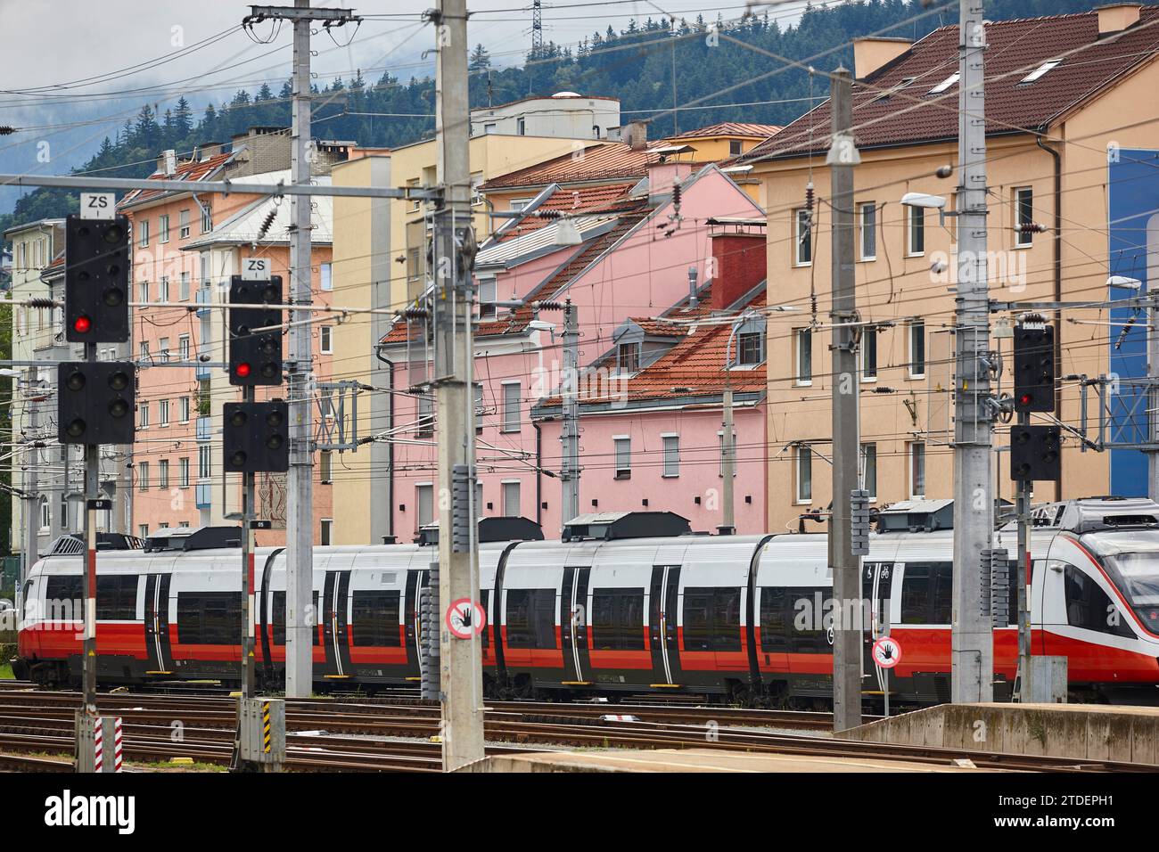 Innsbruck railway station and multicolored houses. Austrian ...