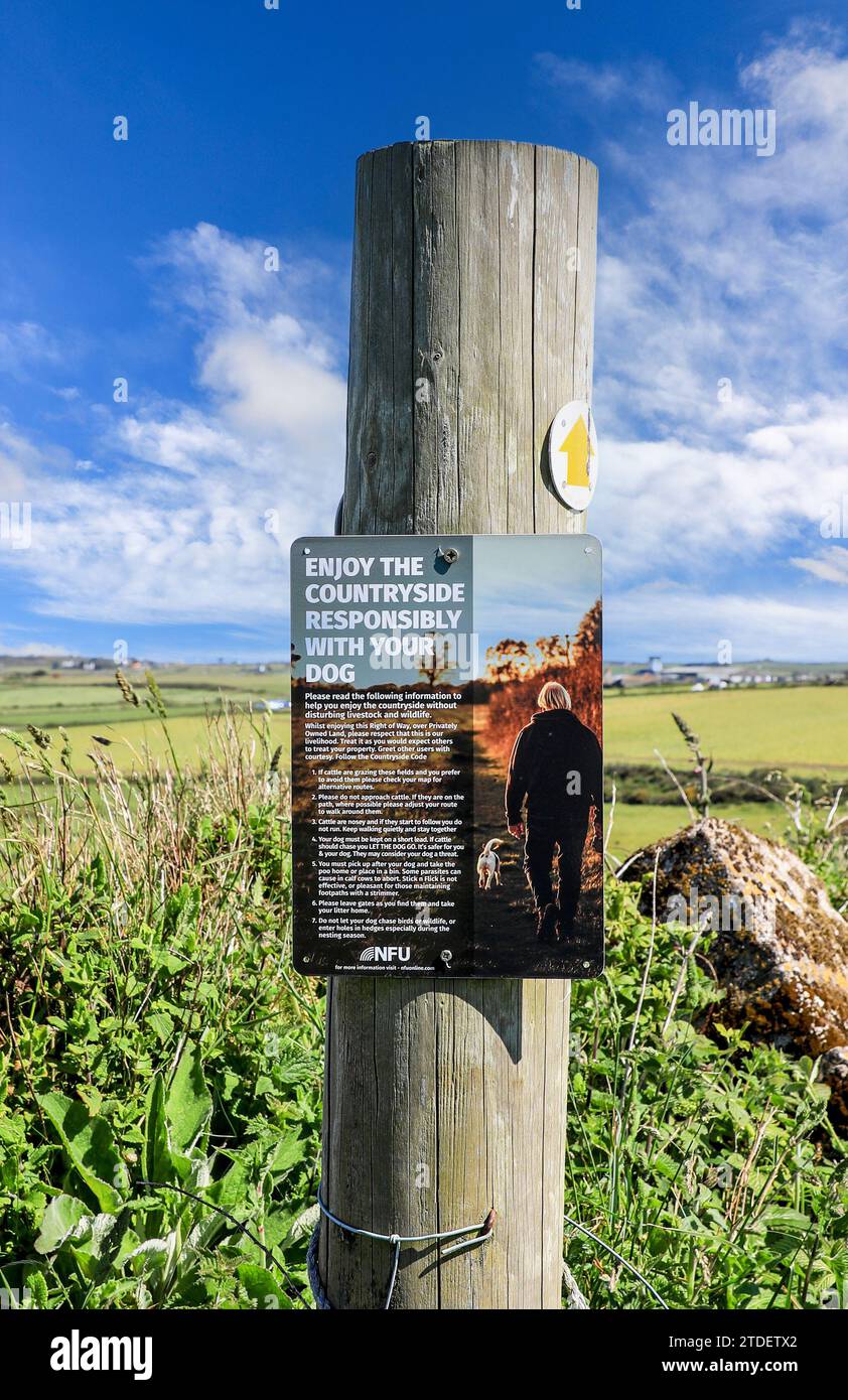 A sign from the National Farmers Union on a post saying 'enjoy the ...