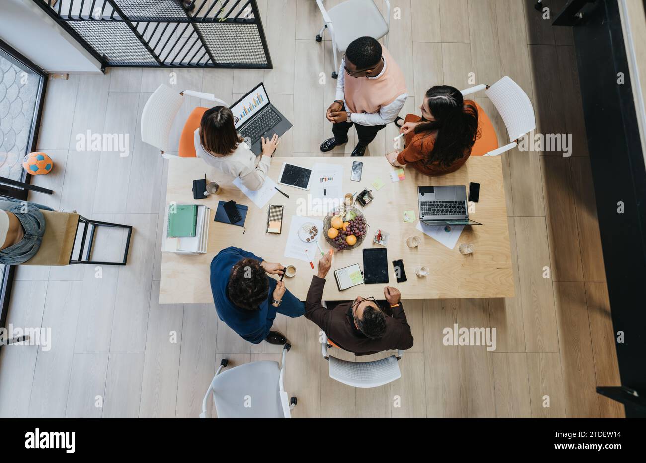 A group of colleagues from different generations discussing business ...