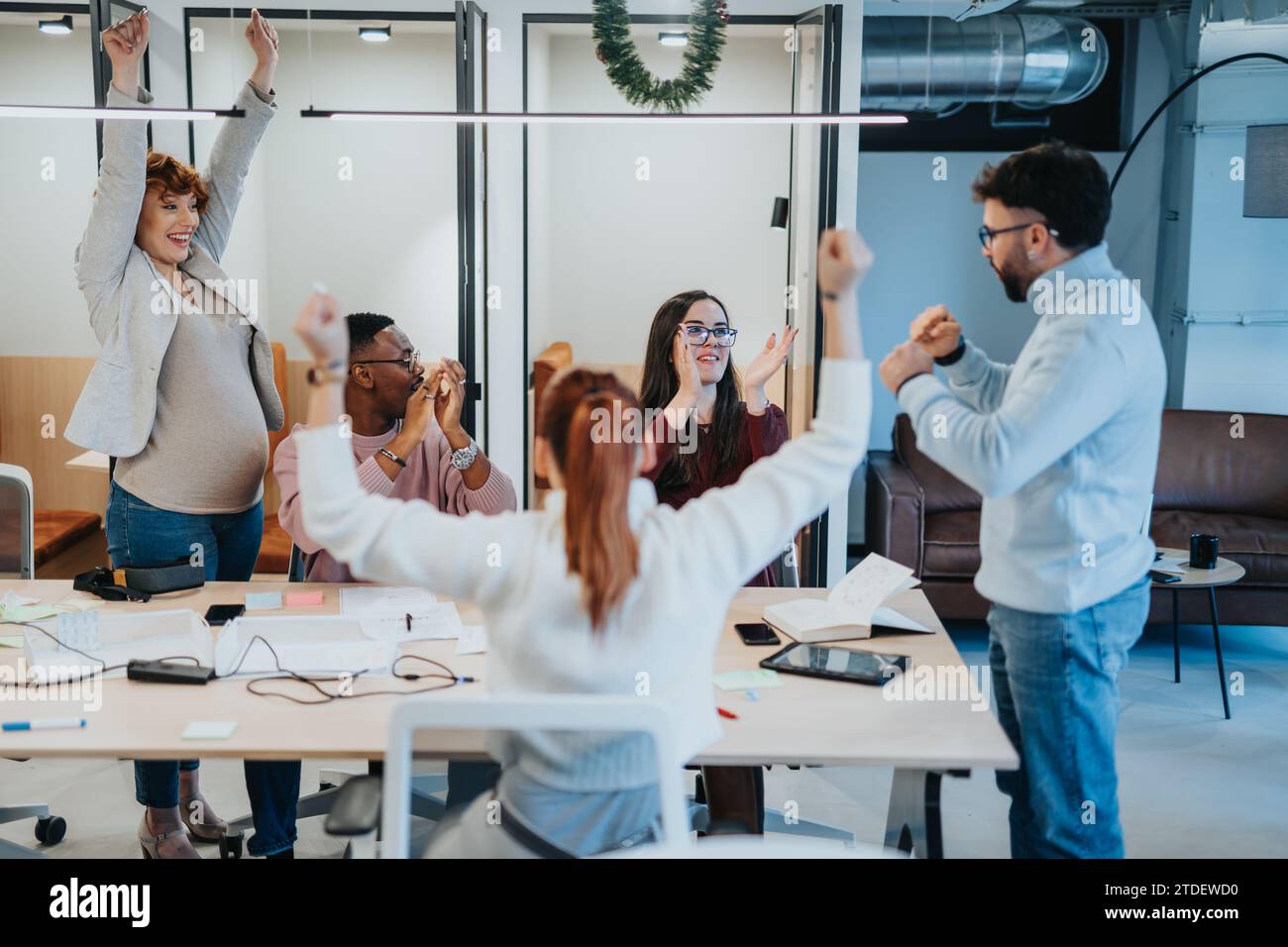 Business professionals celebrating the successful completion of a ...