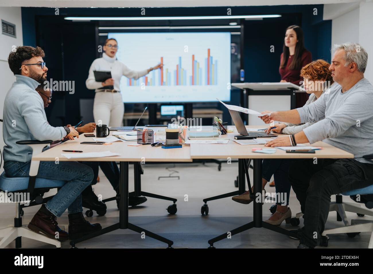 Brainstorming and collaboration in a corporate office with business ...