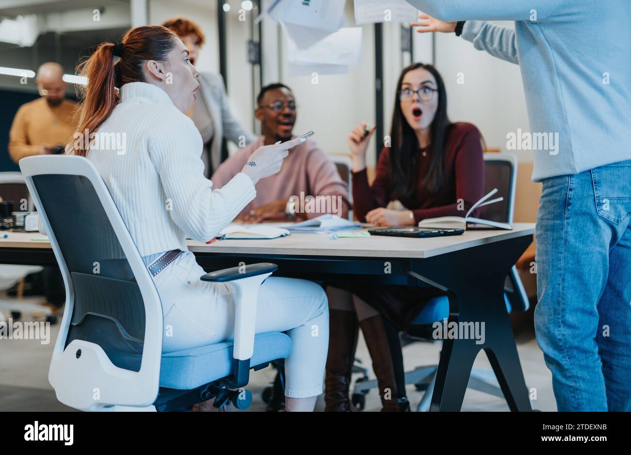 Multiethnic business people celebrating the unexpected after years of ...