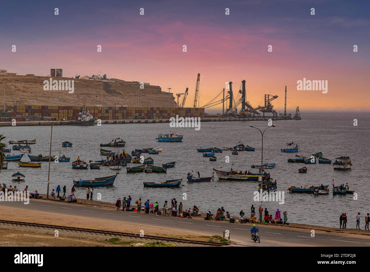 Blue hour over the harbour in the town of Namibe, Angola, Africa Stock ...