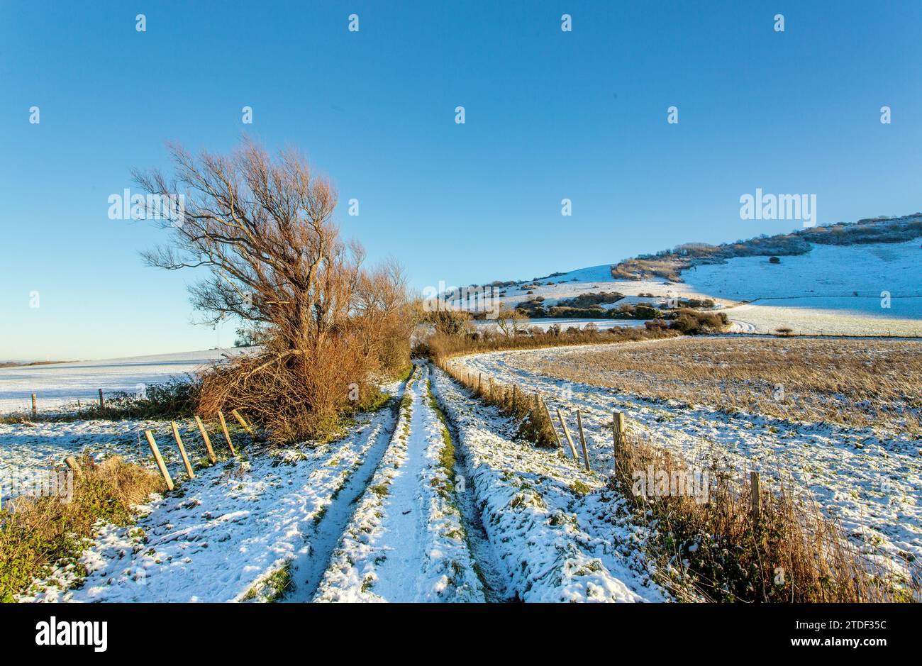 Snowy footpath near the village of Wilmington, South Downs National ...