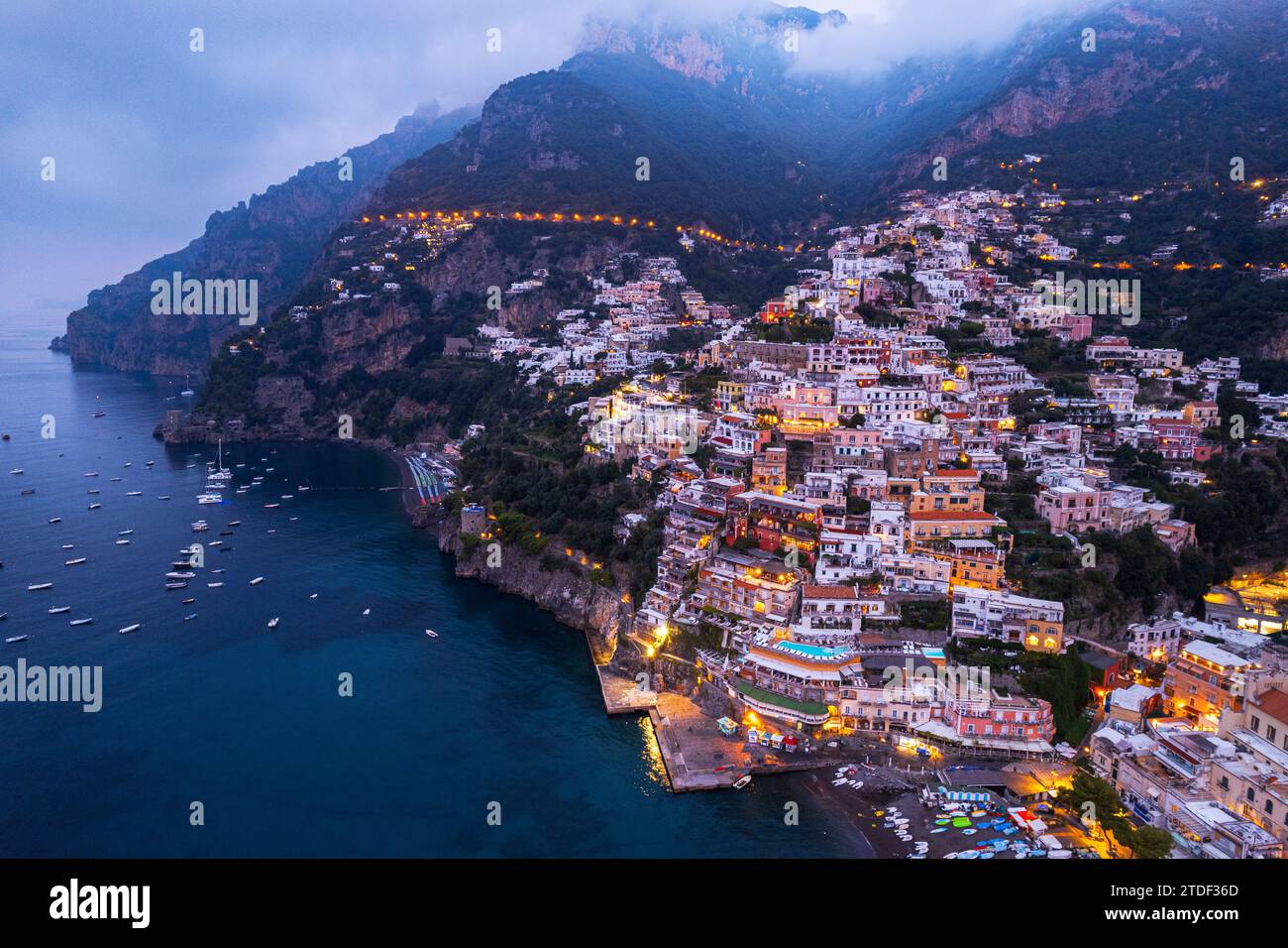 The illuminated and pretty village of Positano at dawn, aerial view ...