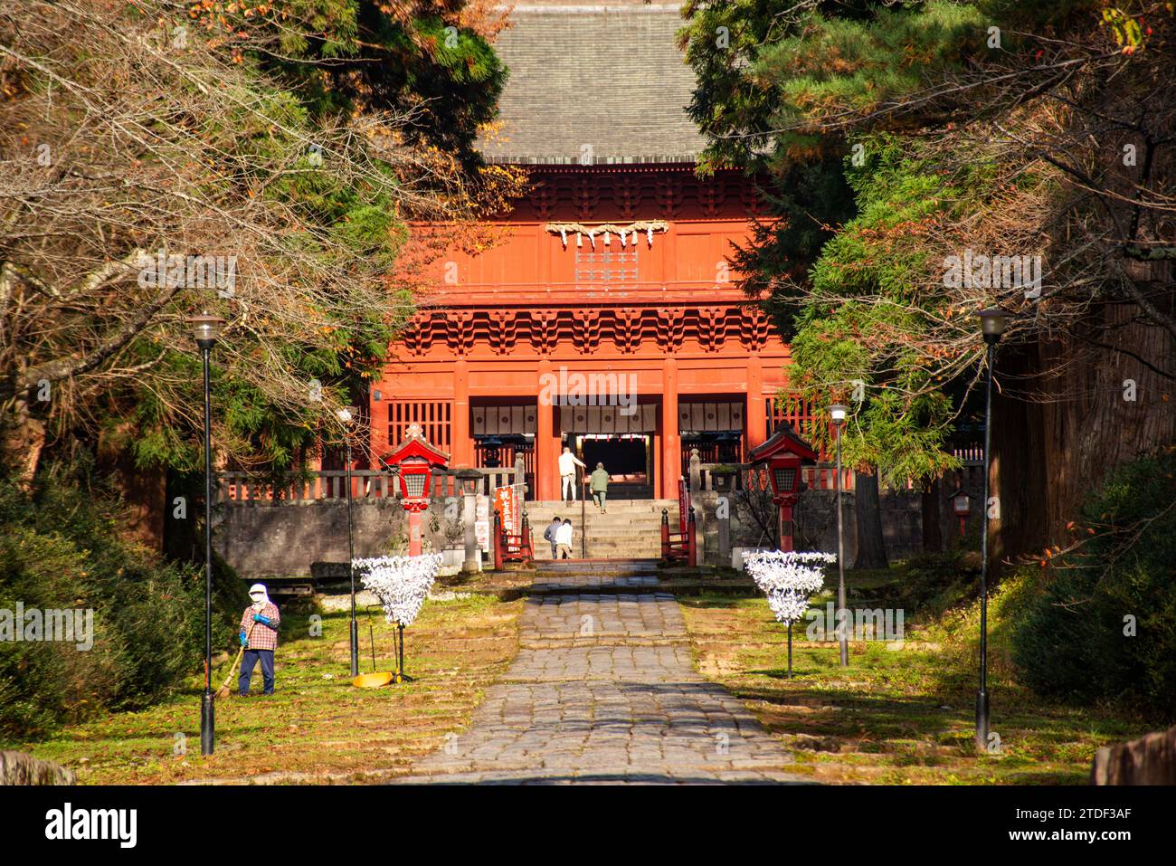 Close up of the fire red main building of The Mount Iwaki Shrine near ...