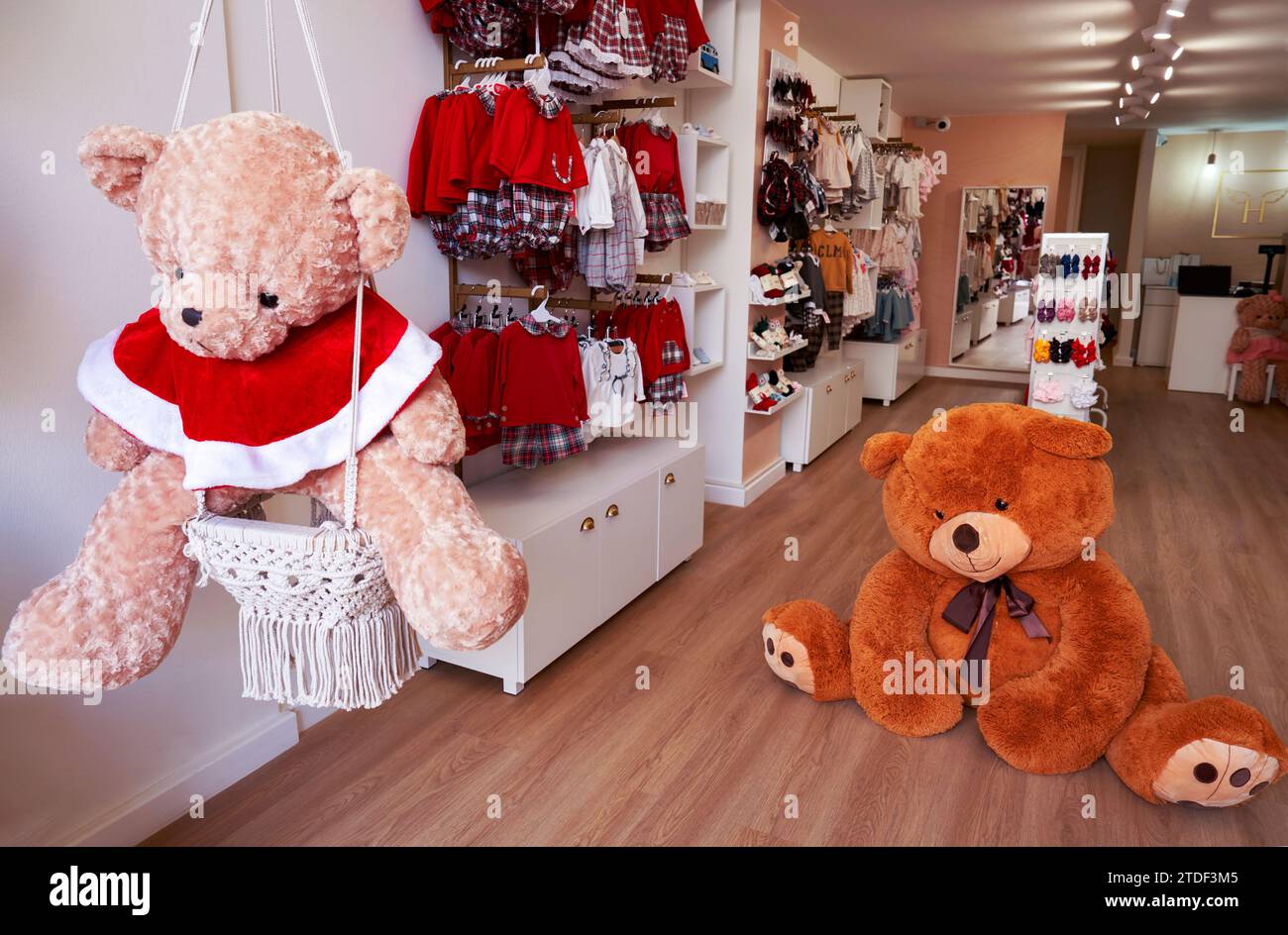 Cute interior of the children's garments shop Stock Photo - Alamy
