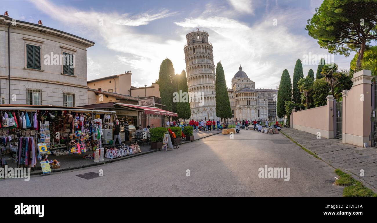 View of souvenir stalls and Leaning Tower of Pisa at sunset, UNESCO ...