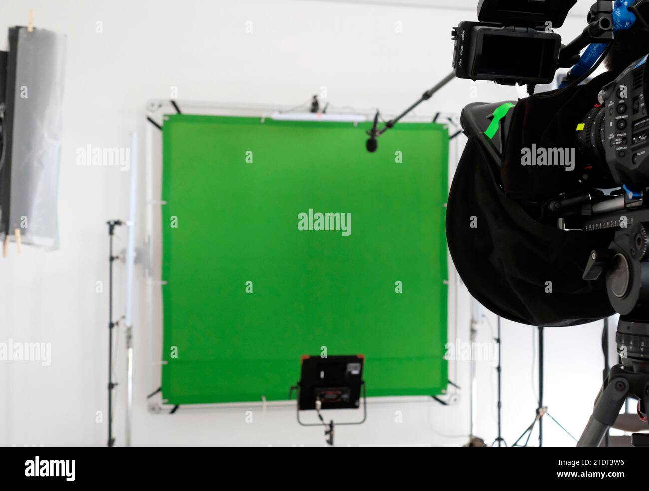 Setup in a TV studio with green screen, lights, and camera Stock Photo ...