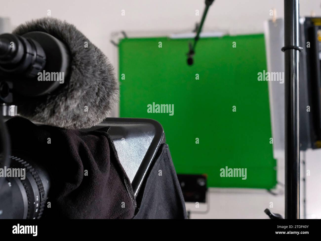 Setup in a TV studio with green screen, lights, and camera Stock Photo ...