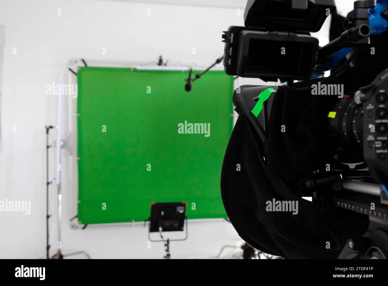 Setup in a TV studio with green screen, lights, and camera Stock Photo ...