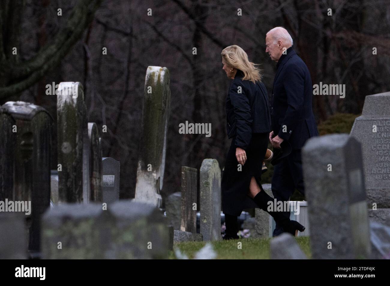 President Joe Biden and first lady Jill Biden, walk between tombstones ...