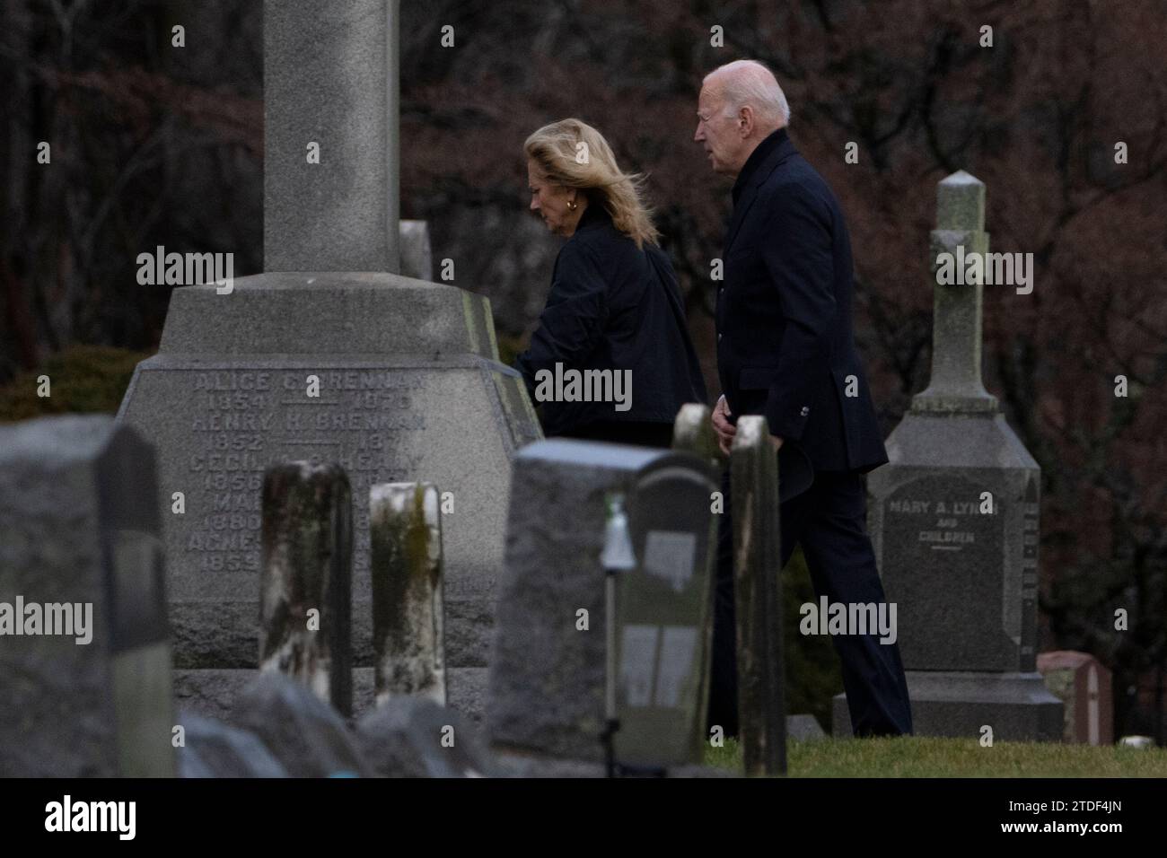 President Joe Biden and first lady Jill Biden, walk between tombstones ...