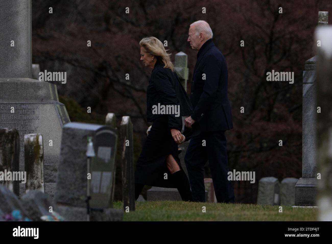 President Joe Biden and first lady Jill Biden, walk between tombstones ...