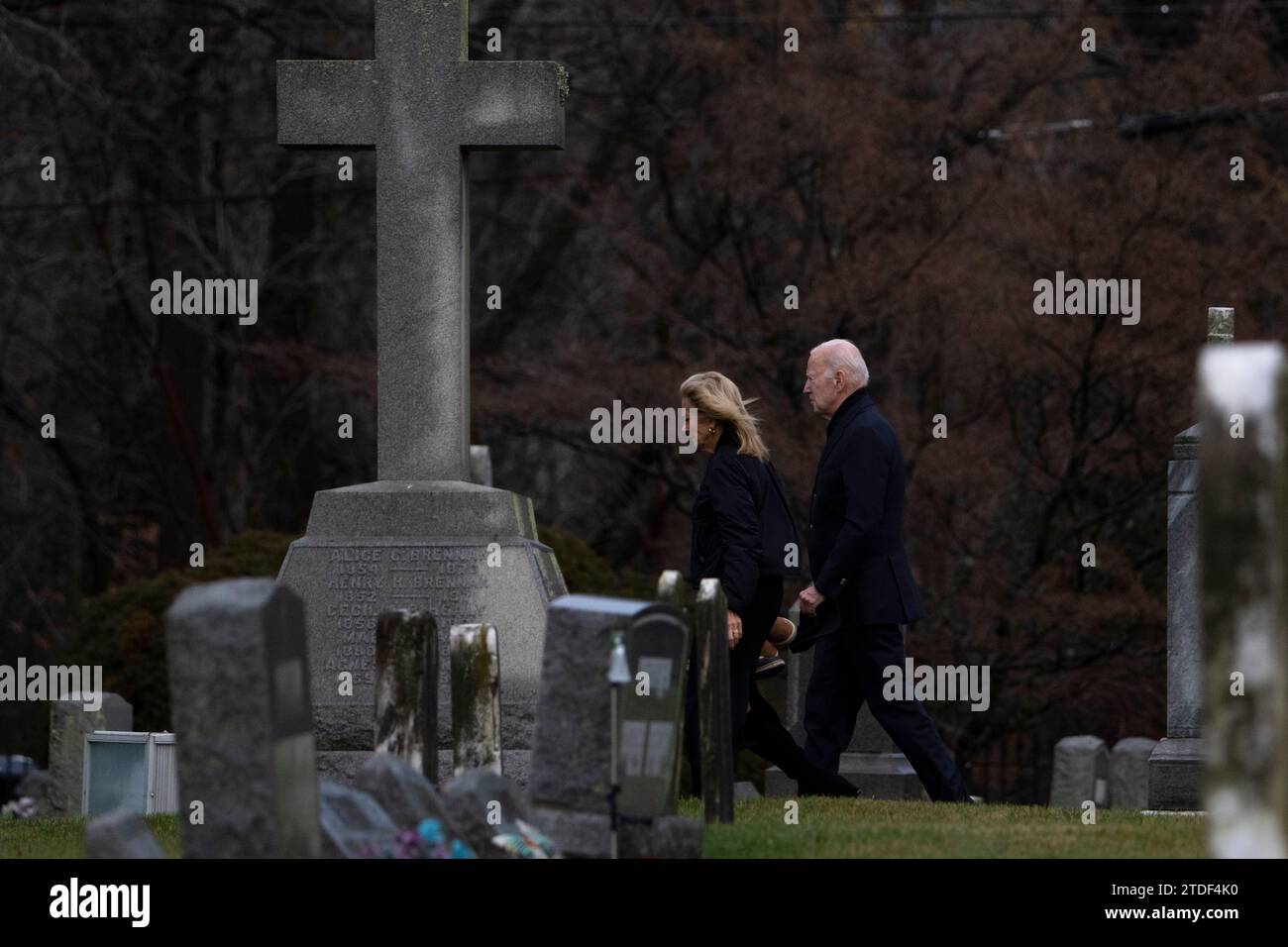 President Joe Biden and first lady Jill Biden, walk between tombstones ...