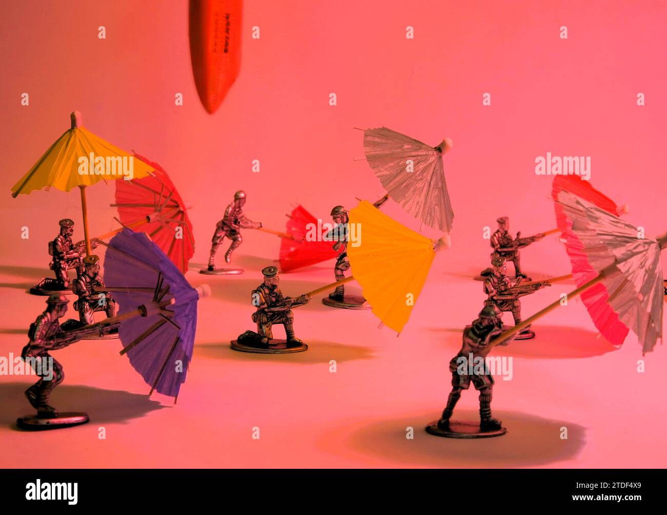 silver toy soldiers armed with colourful coctail umbrellas instead of ...