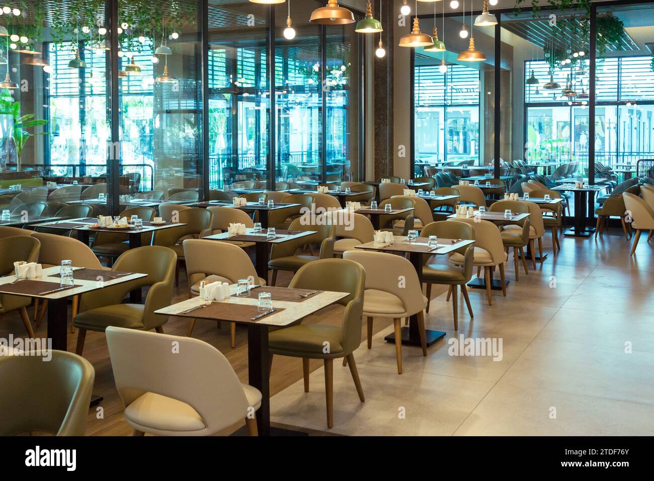 Interior of an empty restaurant hall with large windows Stock Photo - Alamy