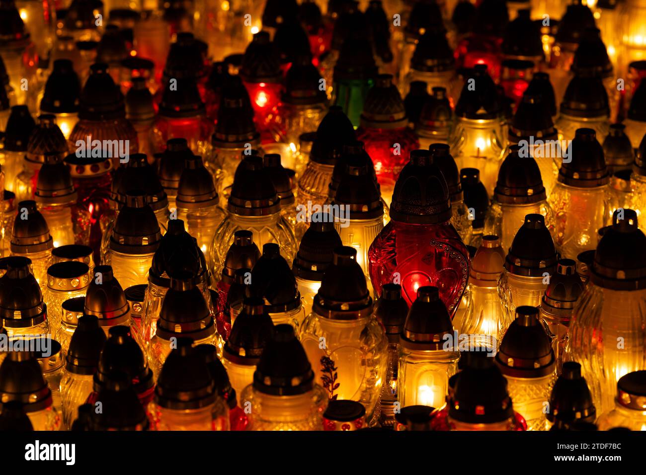 Lots of glass candles burning in the cemetery. A night shot of cemetery ...