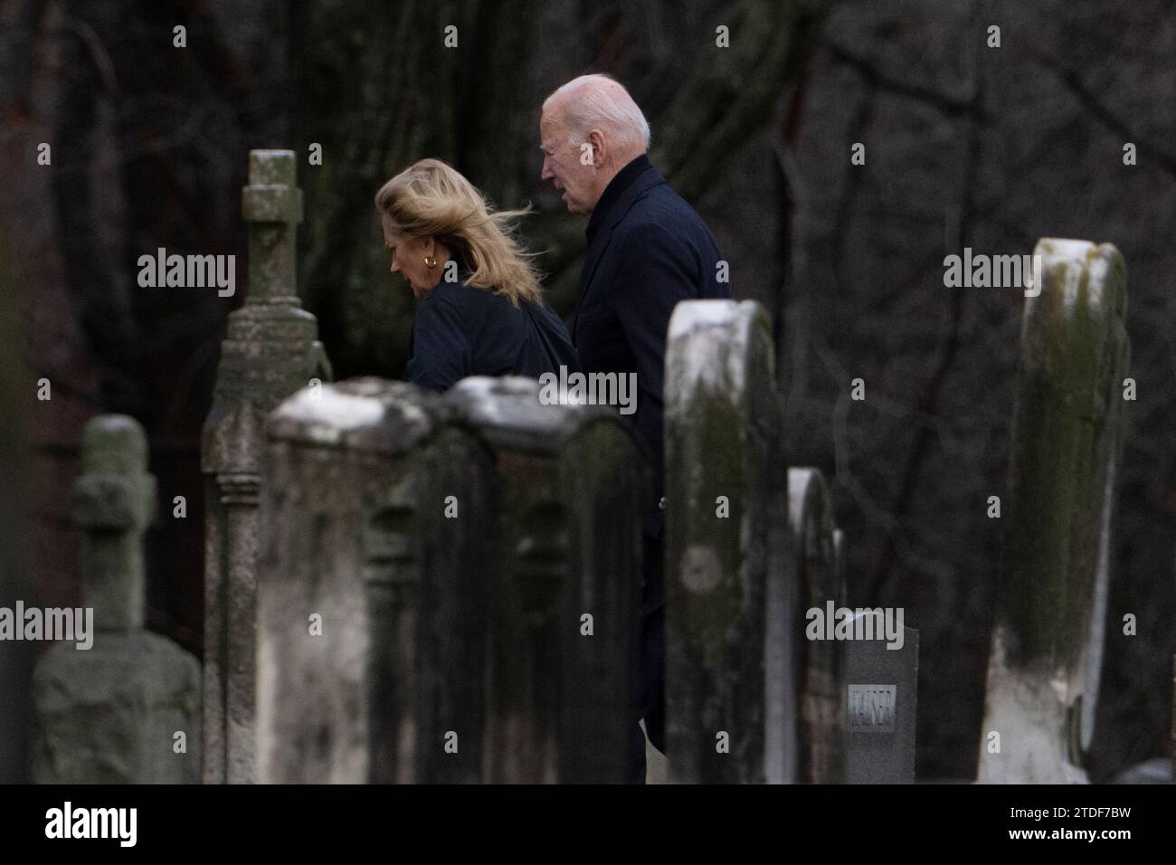 President Joe Biden and first lady Jill Biden, walk between tombstones ...