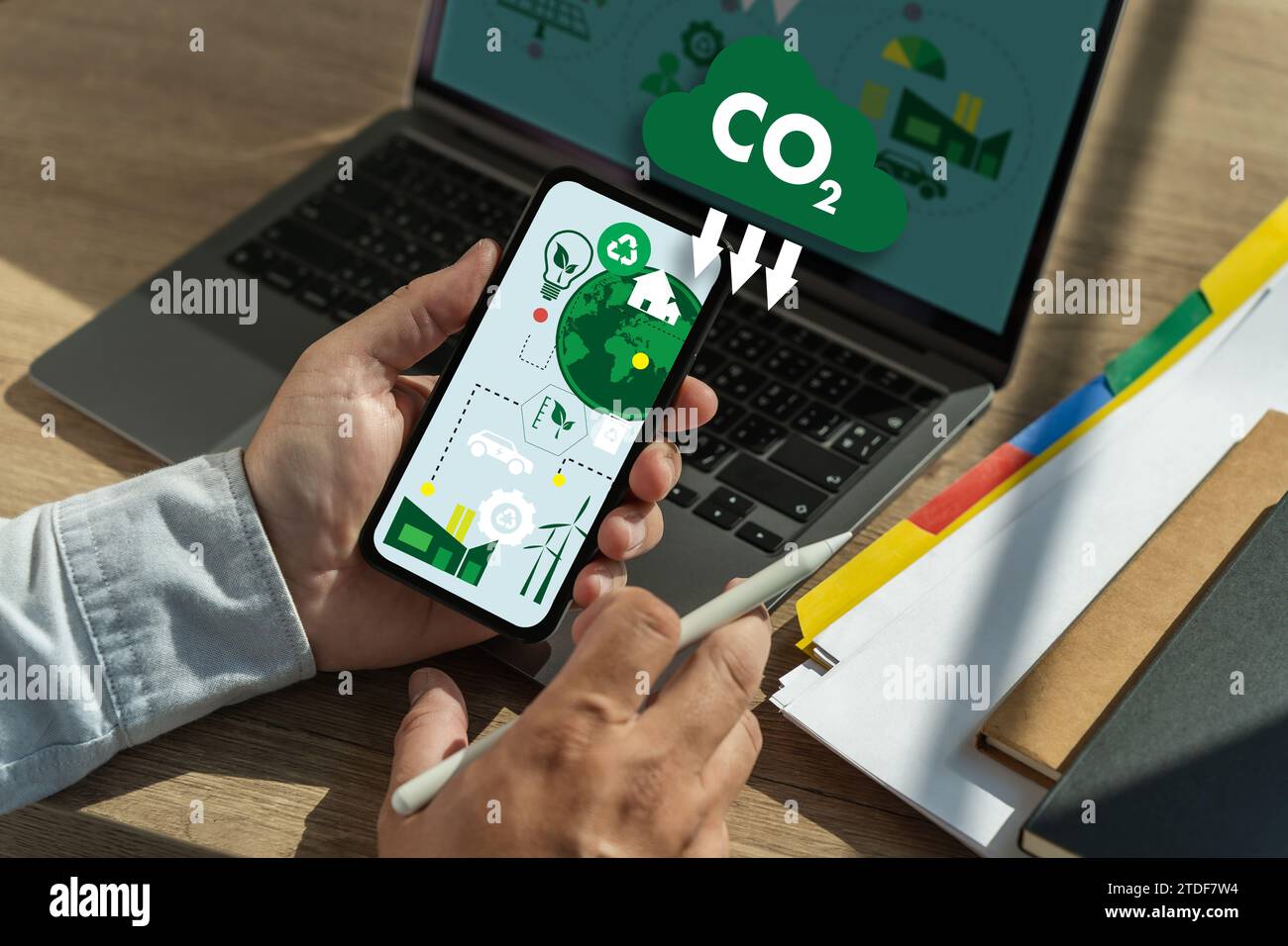 Businessman working computer to reduce CO2 depicting the issue of ...