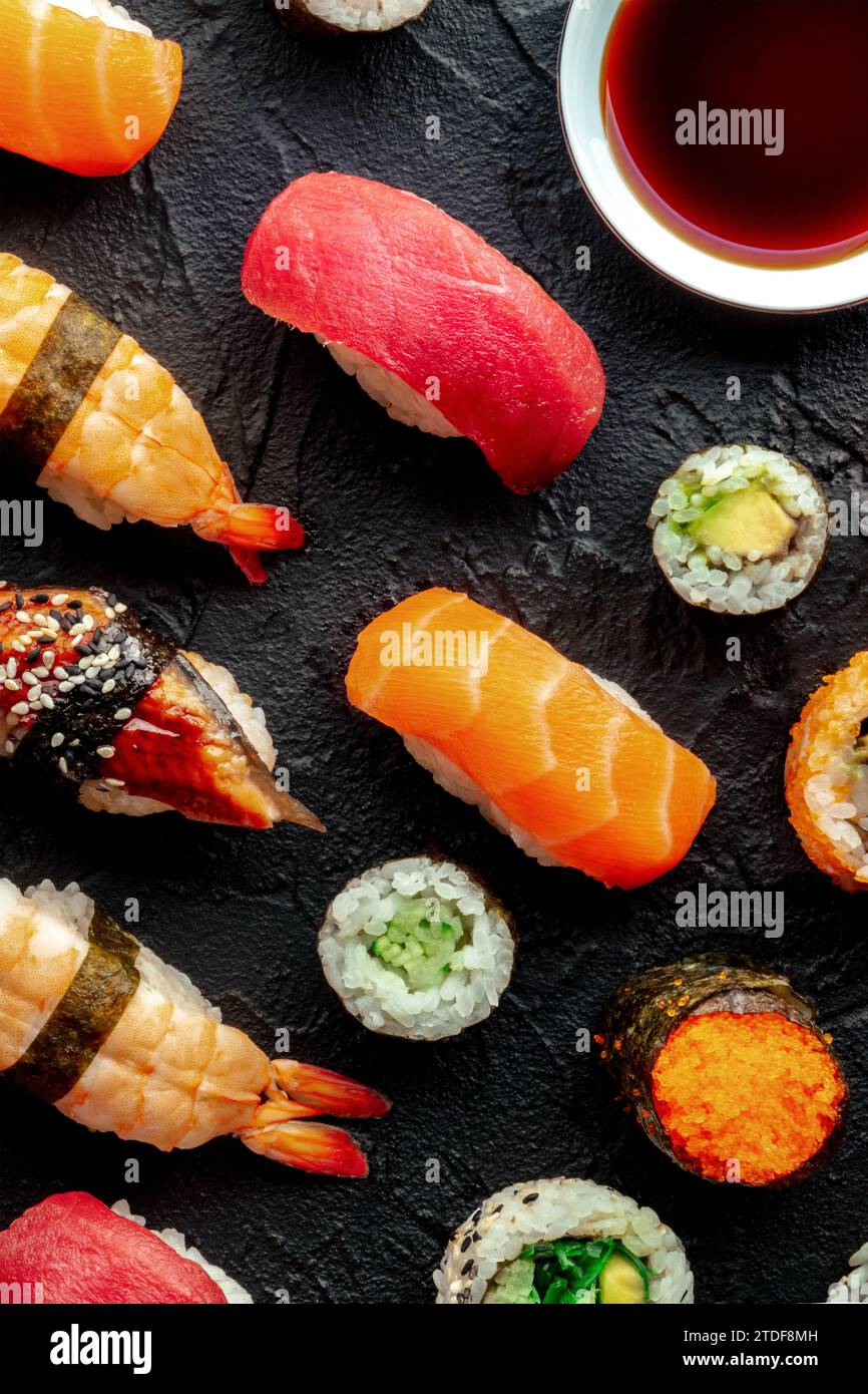 Sushi with soy sauce. An variety of rolls, maki, nigiri etc, shot from ...