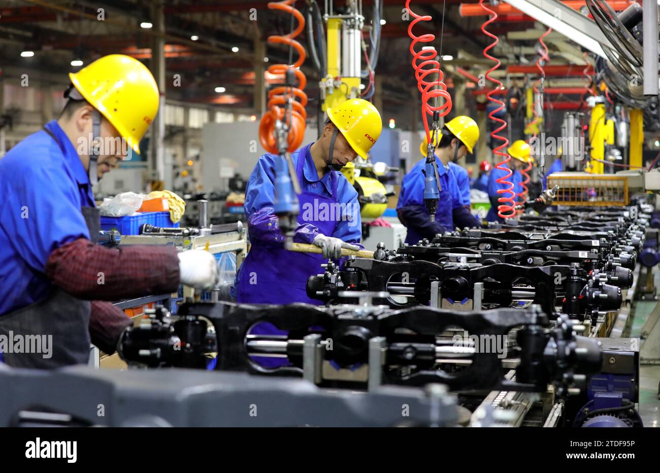 ANQING, CHINA - DECEMBER 12, 2023 - Employees work on the assembly line ...