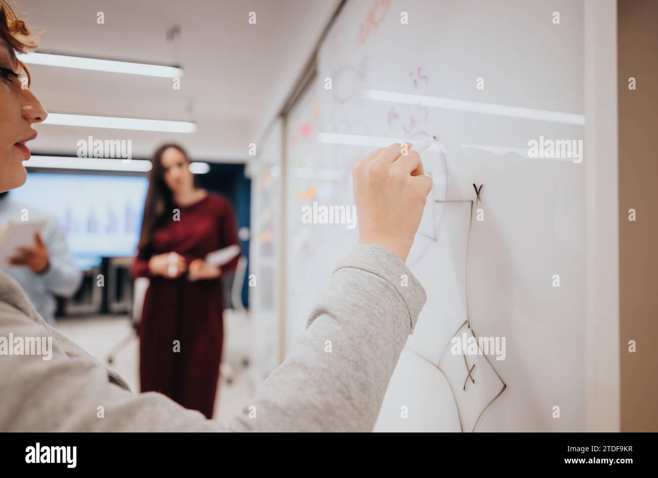 Successful Business Team Analyzing Statistics And Brainstorming In