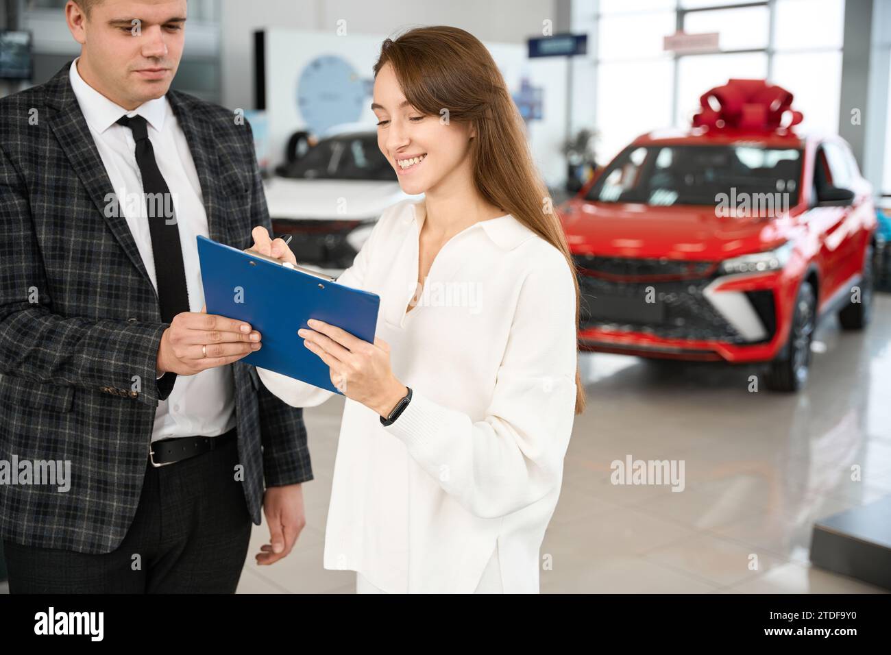 Car dealer holding documents hi-res stock photography and images - Alamy