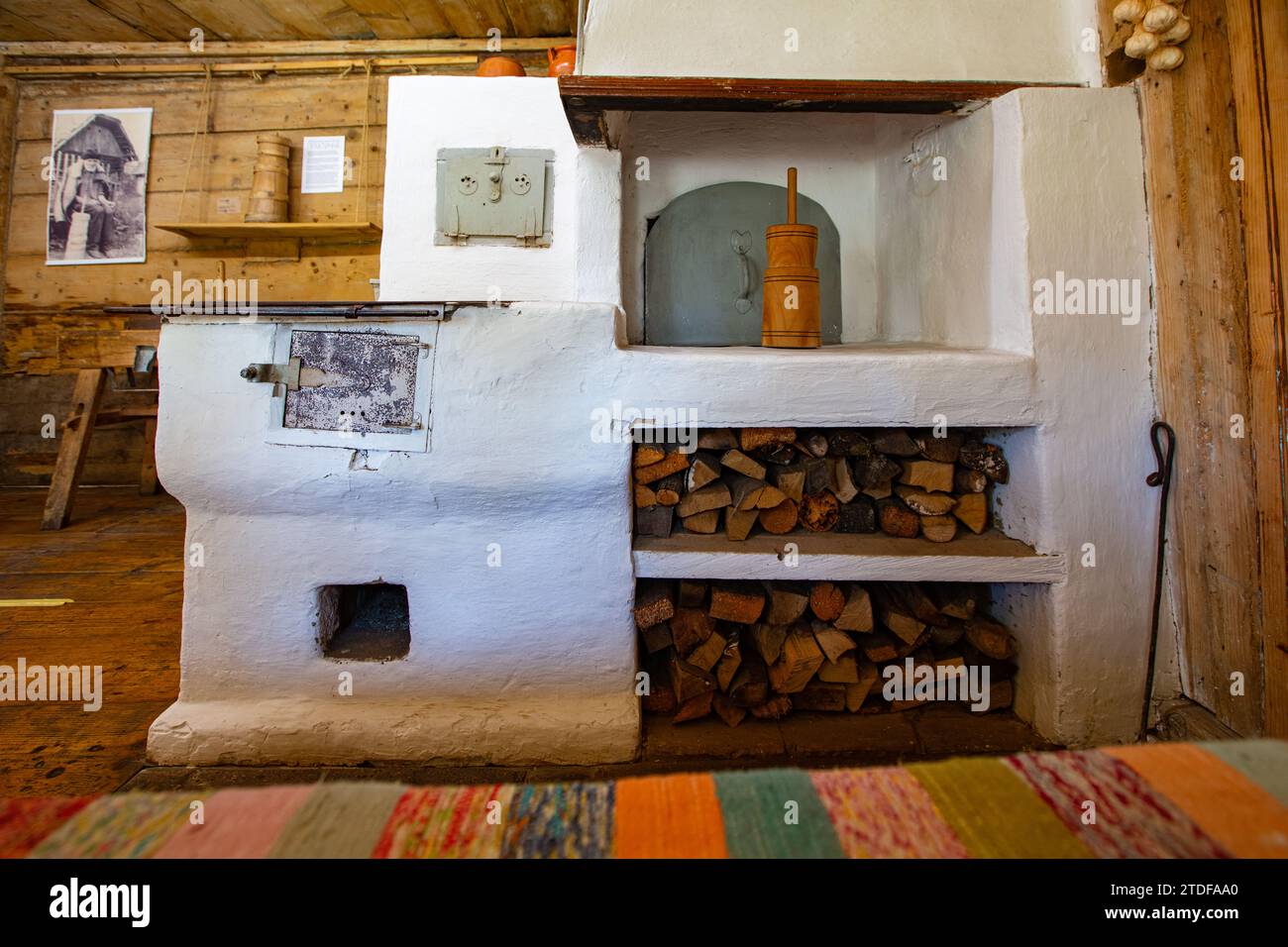 Ancient traditional clay stove in ancient wooden house in Lviv region ...