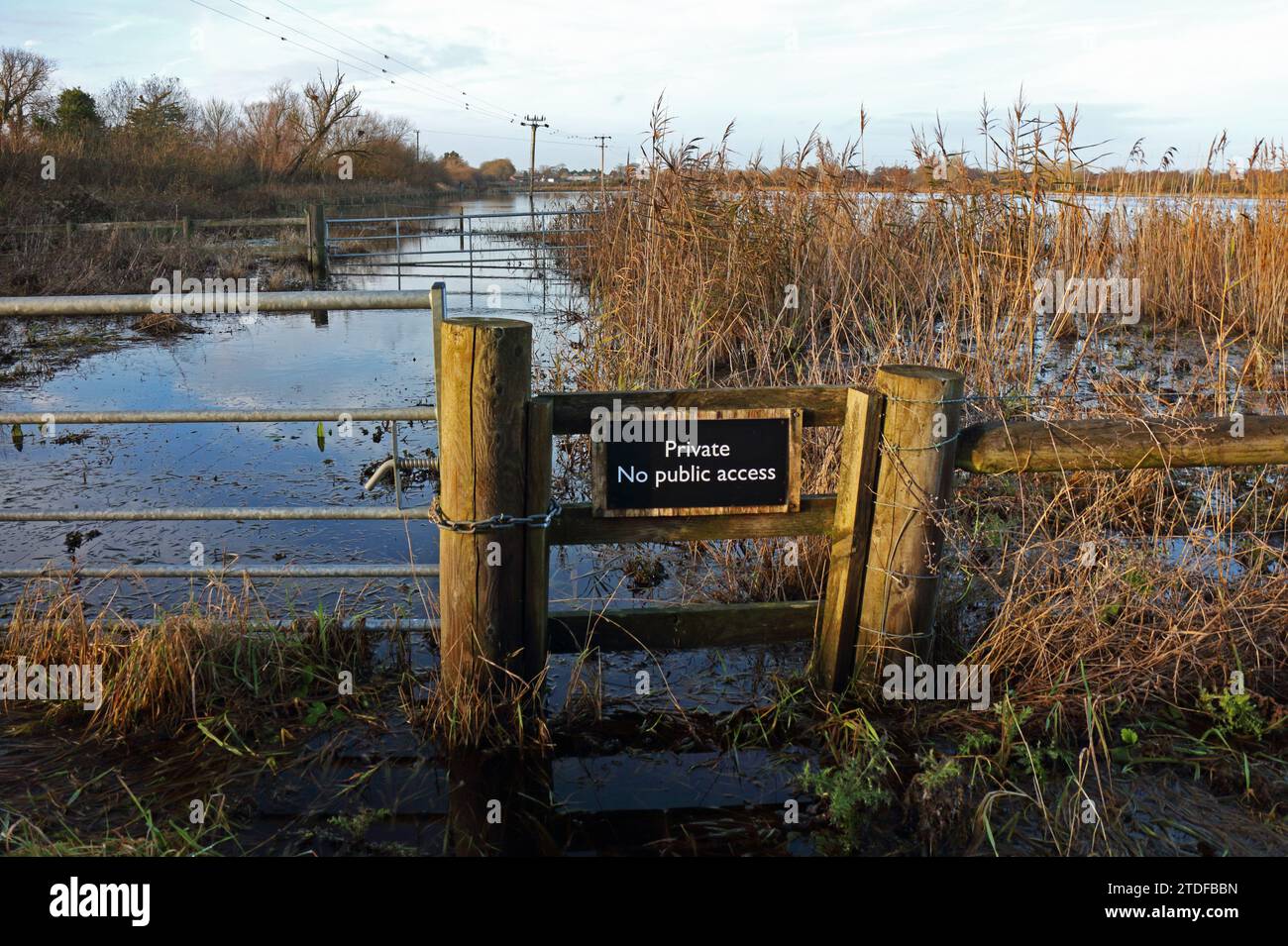 A gate with Private No Public Access sign to enter flooded grazing ...