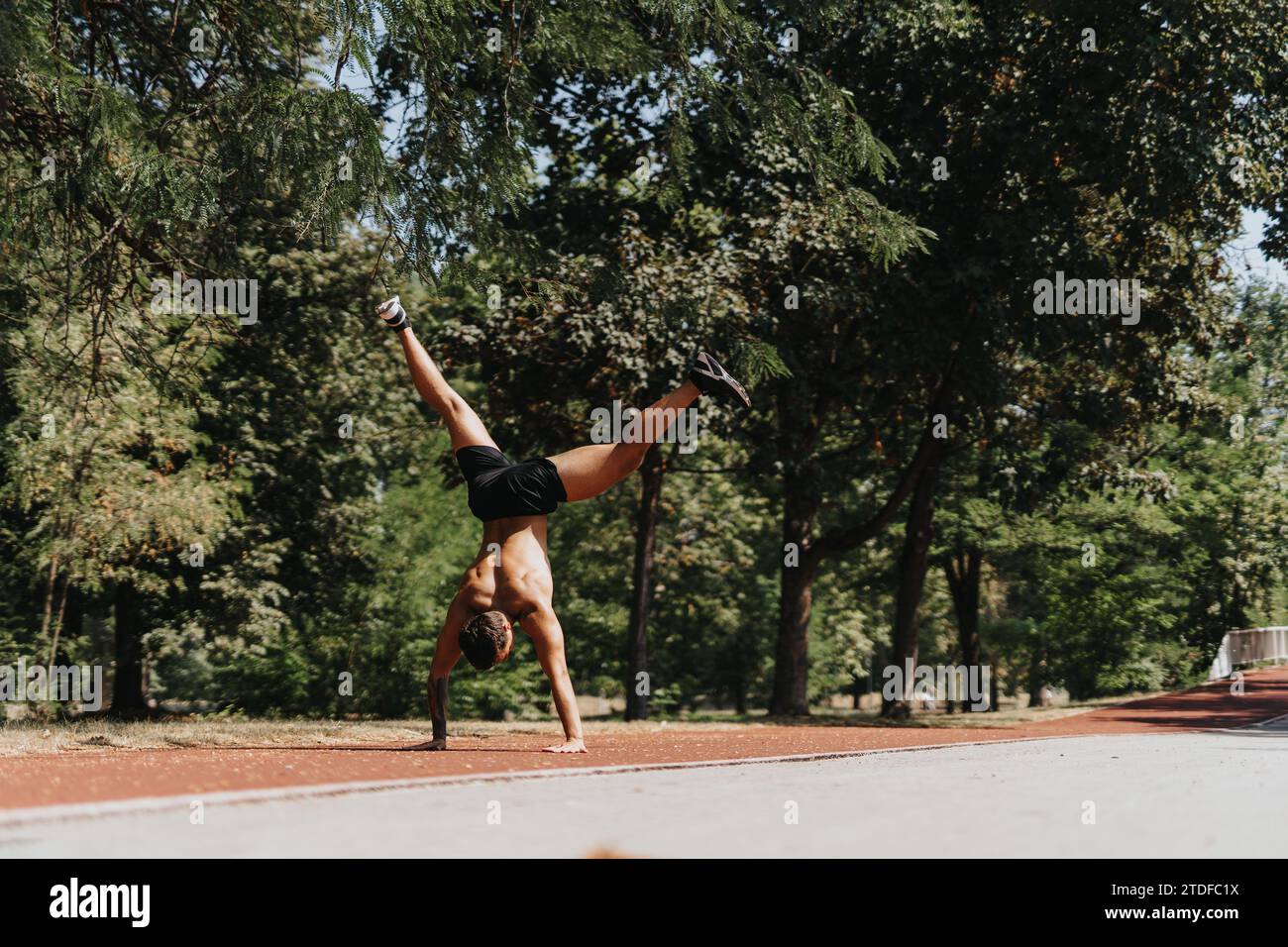 Sports Man Show Impressive Cartwheel Skills Outdoors Stock Photo - Alamy