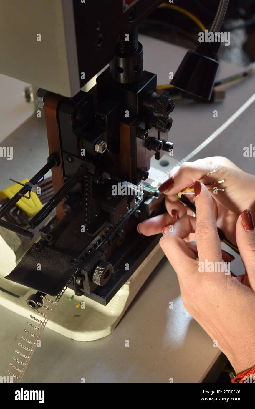 Crimping cable terminals on a crimp machine Stock Photo - Alamy
