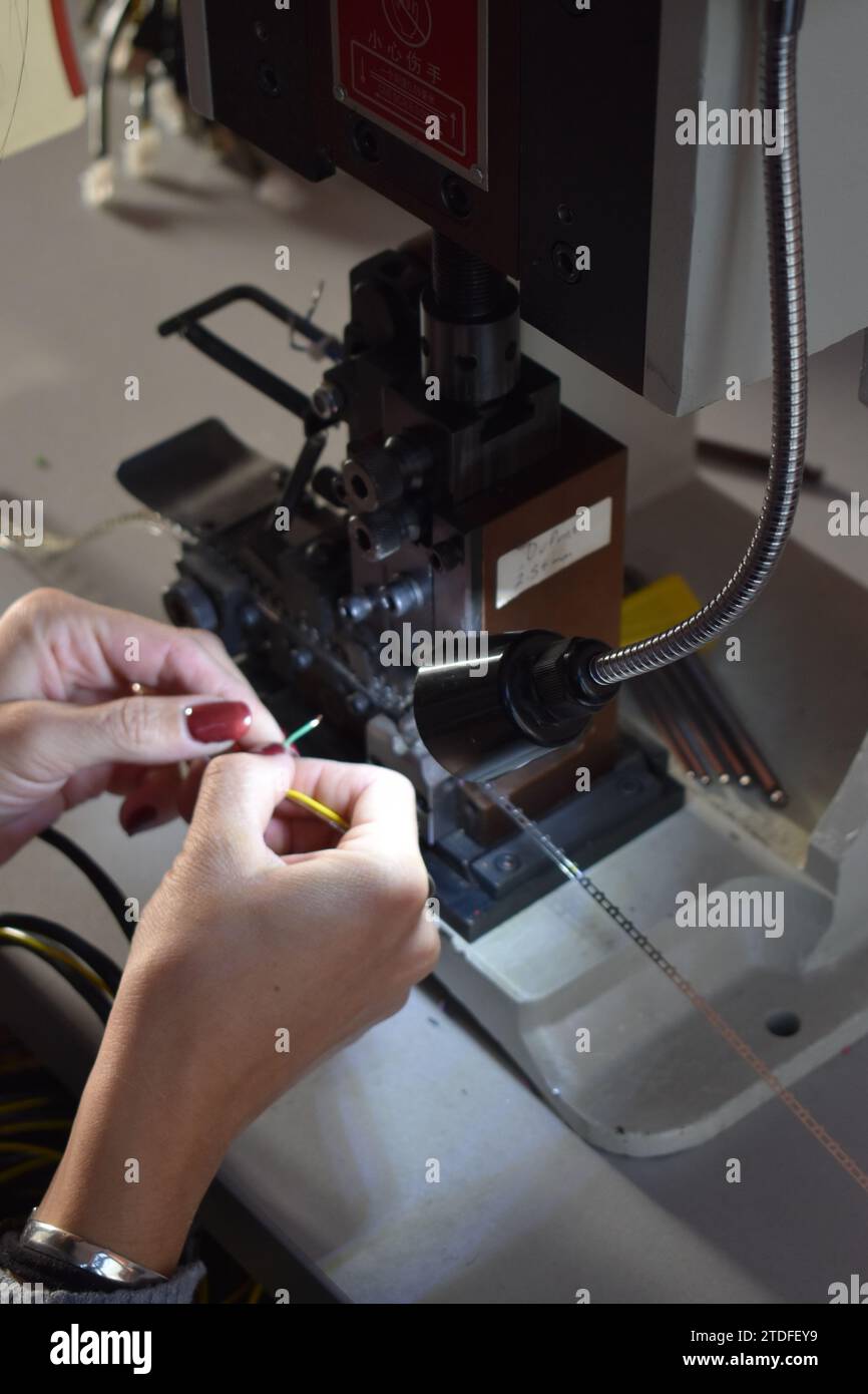Crimping cable terminals on a crimp machine Stock Photo - Alamy