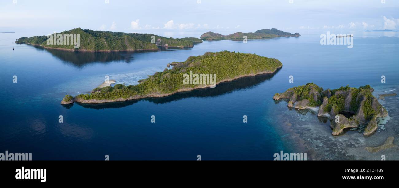 Limestone islands rise from the seascape in Raja Ampat, Indonesia ...