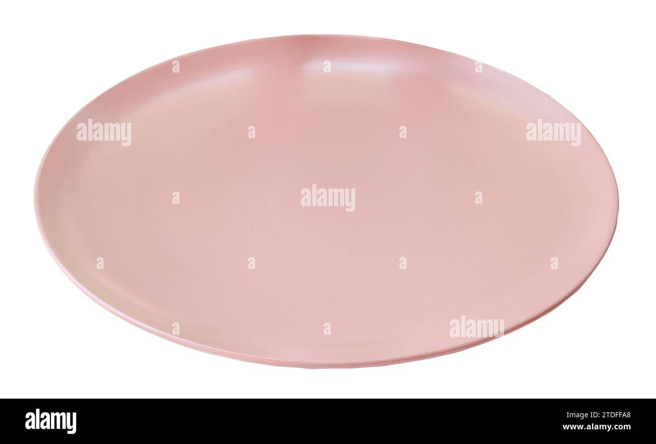 Beautiful pink ceramic plate is isolated on white background with ...