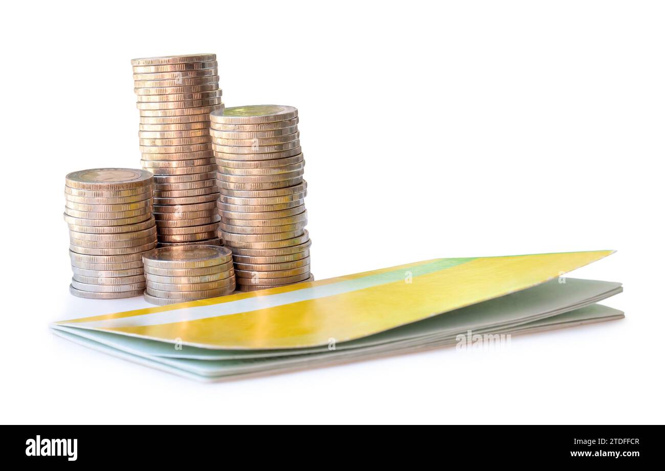 Silver coins in separated stacks with bank book are isolated on white ...