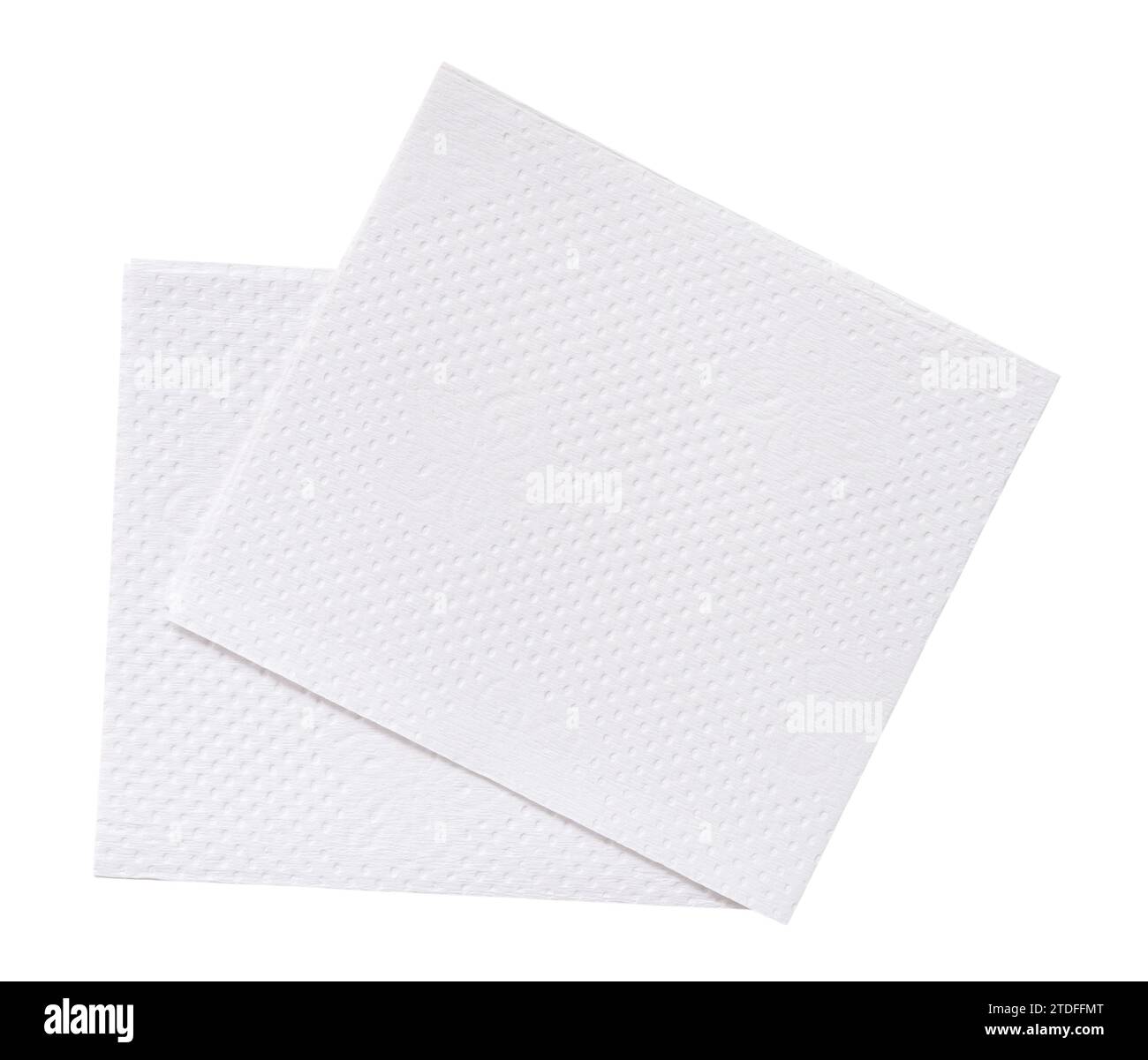 Two folded pieces of white tissue paper or napkin in stack tidily ...