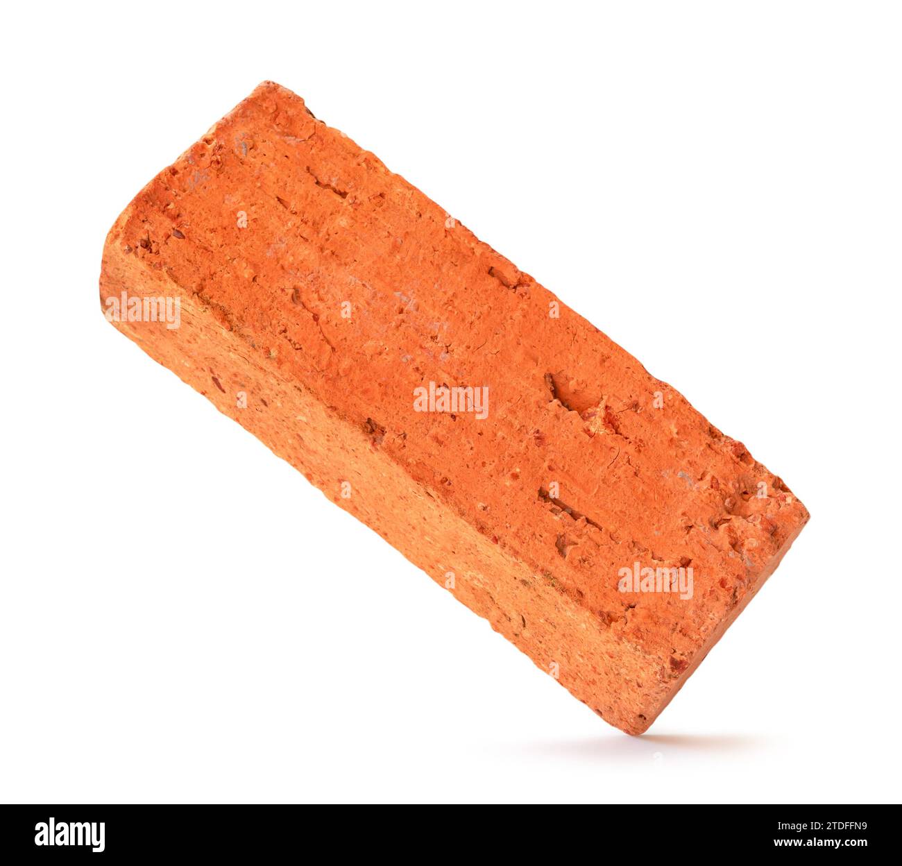Single cracked old red or orange brick is isolated on white background ...