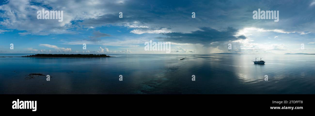 Sunrise illuminates the remote island of Koon near Seram, Indonesia ...