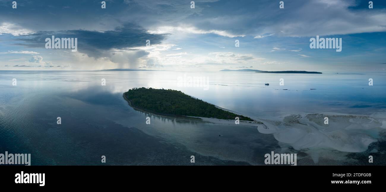 Sunrise illuminates the remote island of Koon near Seram, Indonesia ...