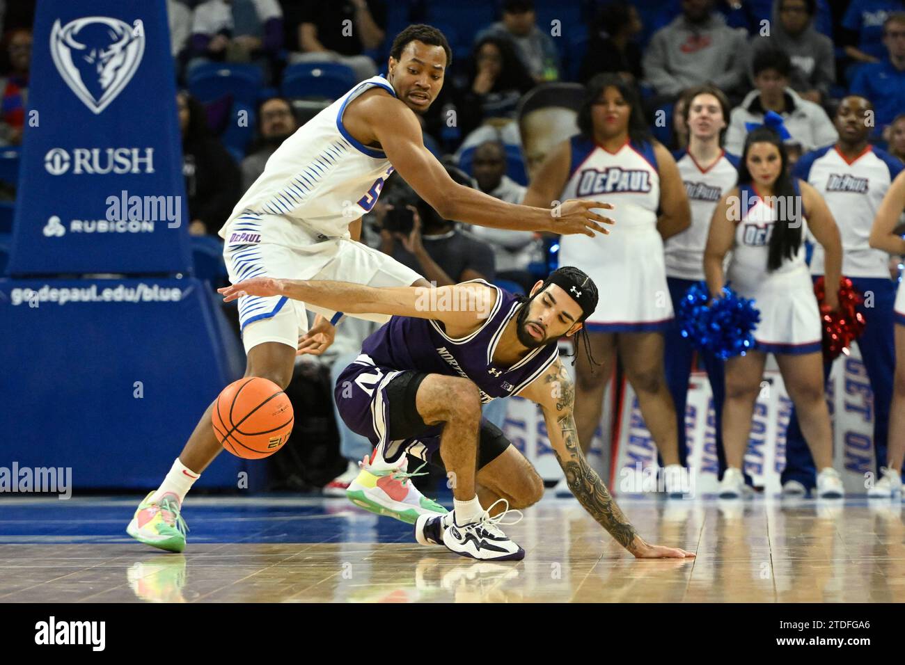 Northwestern guard Boo Buie grabs a loose ball away from DePaul center ...