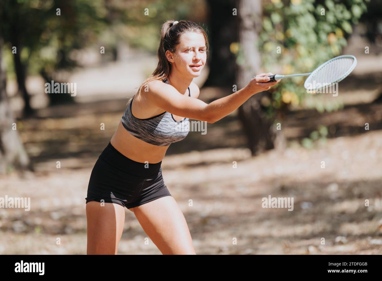 Attractive Girls Playing Badminton in a Sunny Park Stock Photo - Alamy