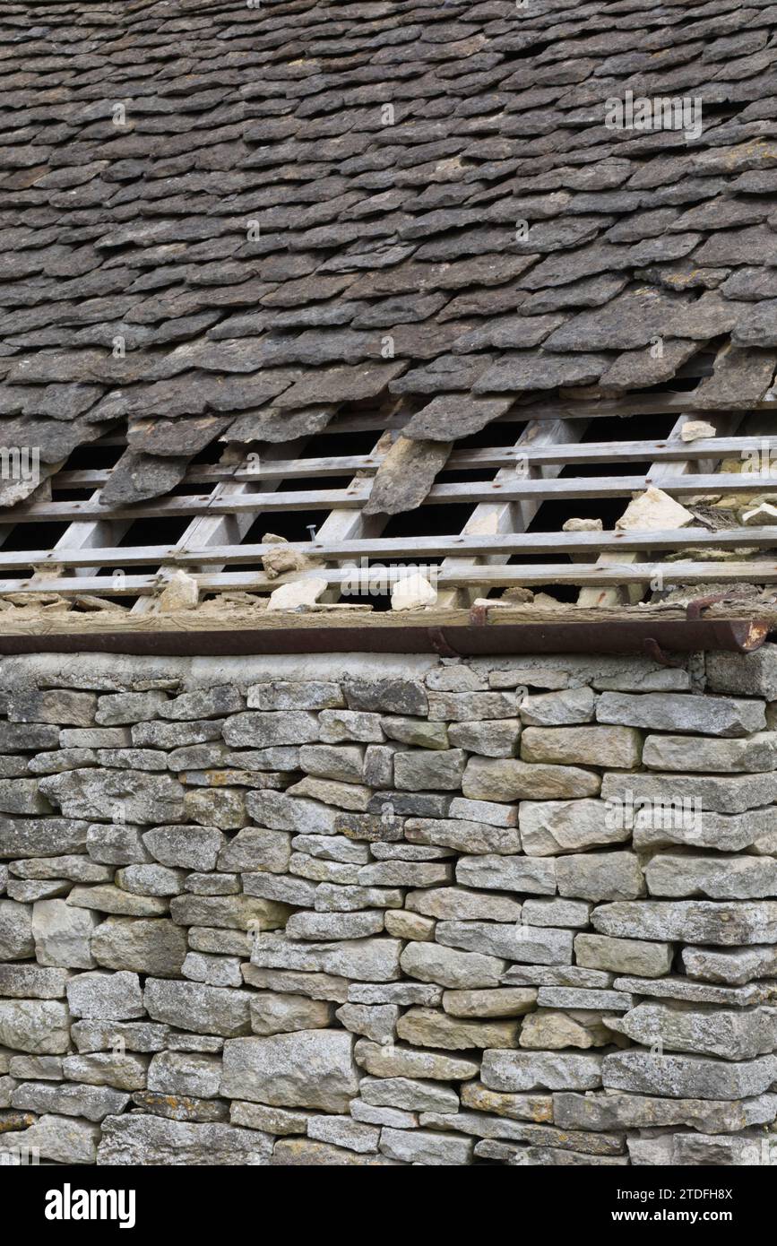 old stone cottage with slated roof being repaired Stock Photo - Alamy