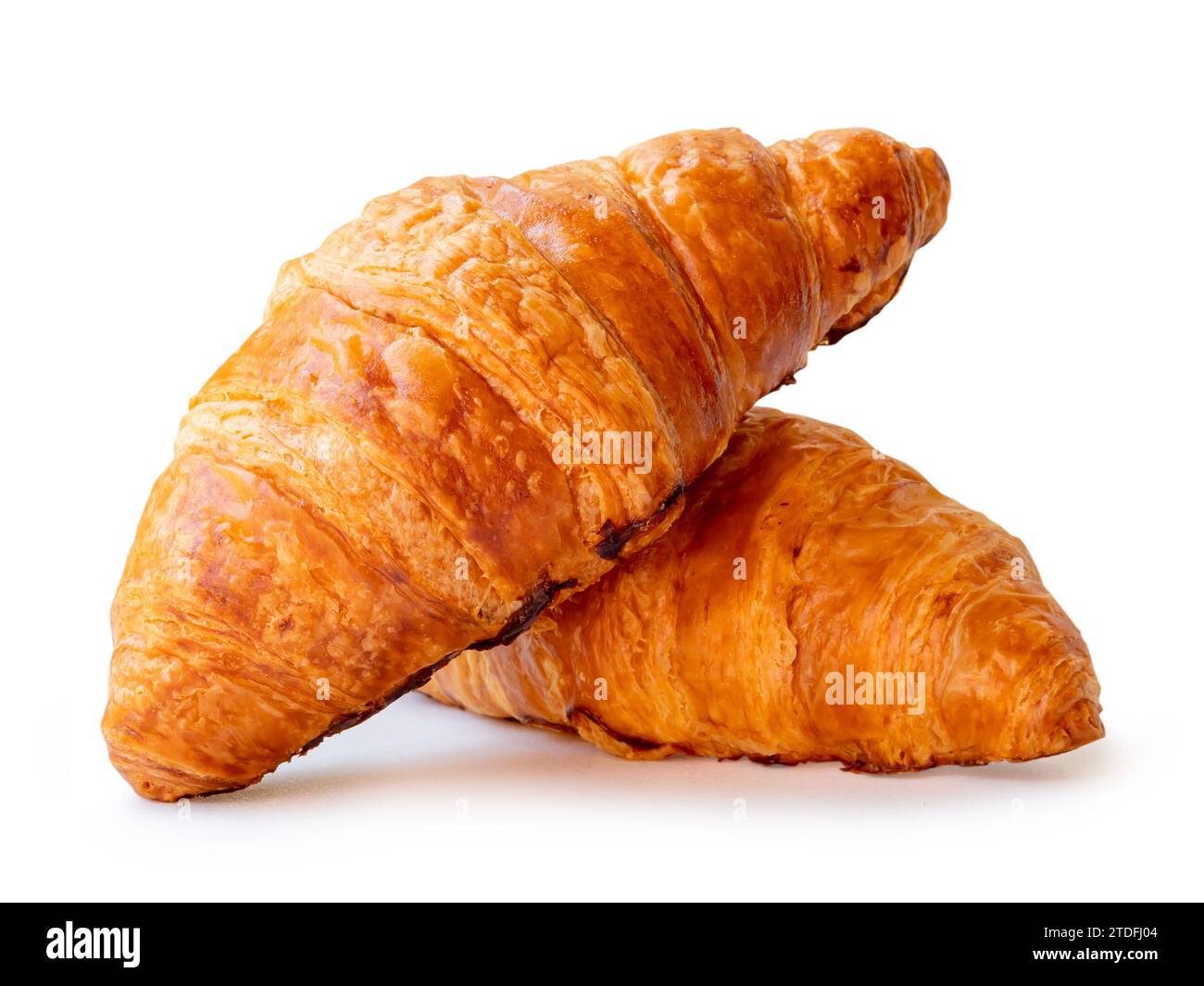 two piece of croissant in stack or cross shape are isolated on white ...