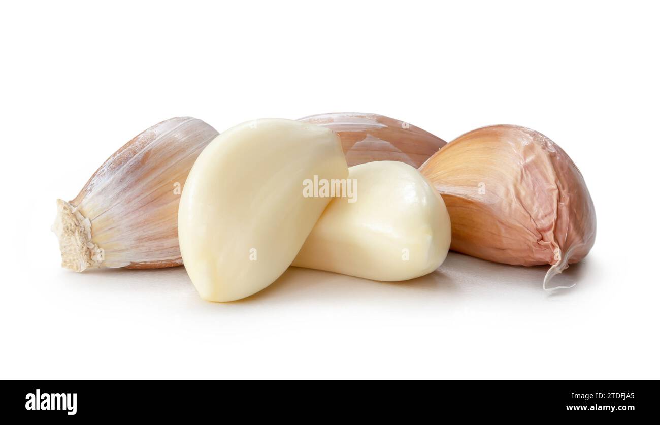 Peeled garlic cloves in stack are isolated on white background with ...