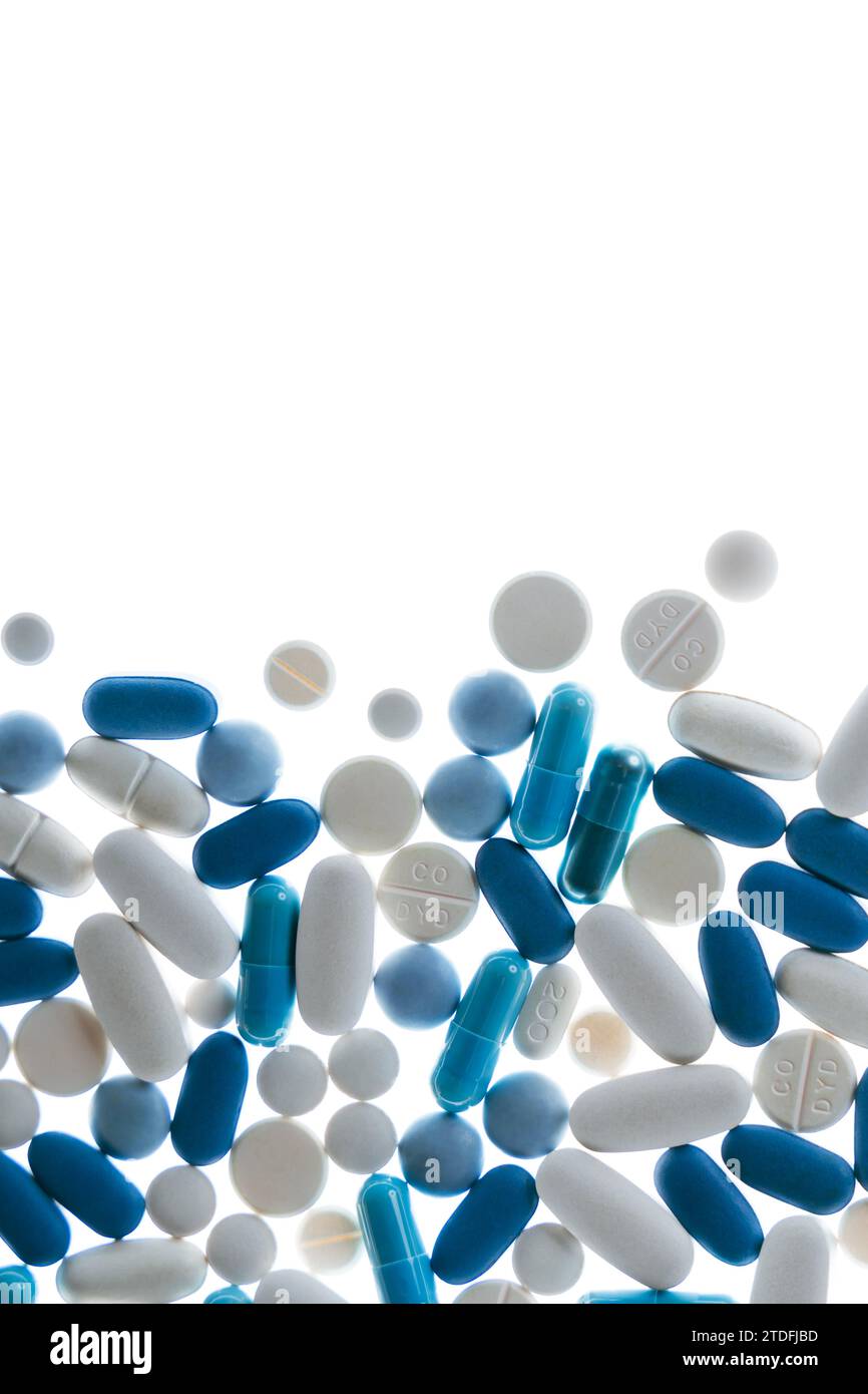 Blue and white pills and tablets against white background Stock Photo ...